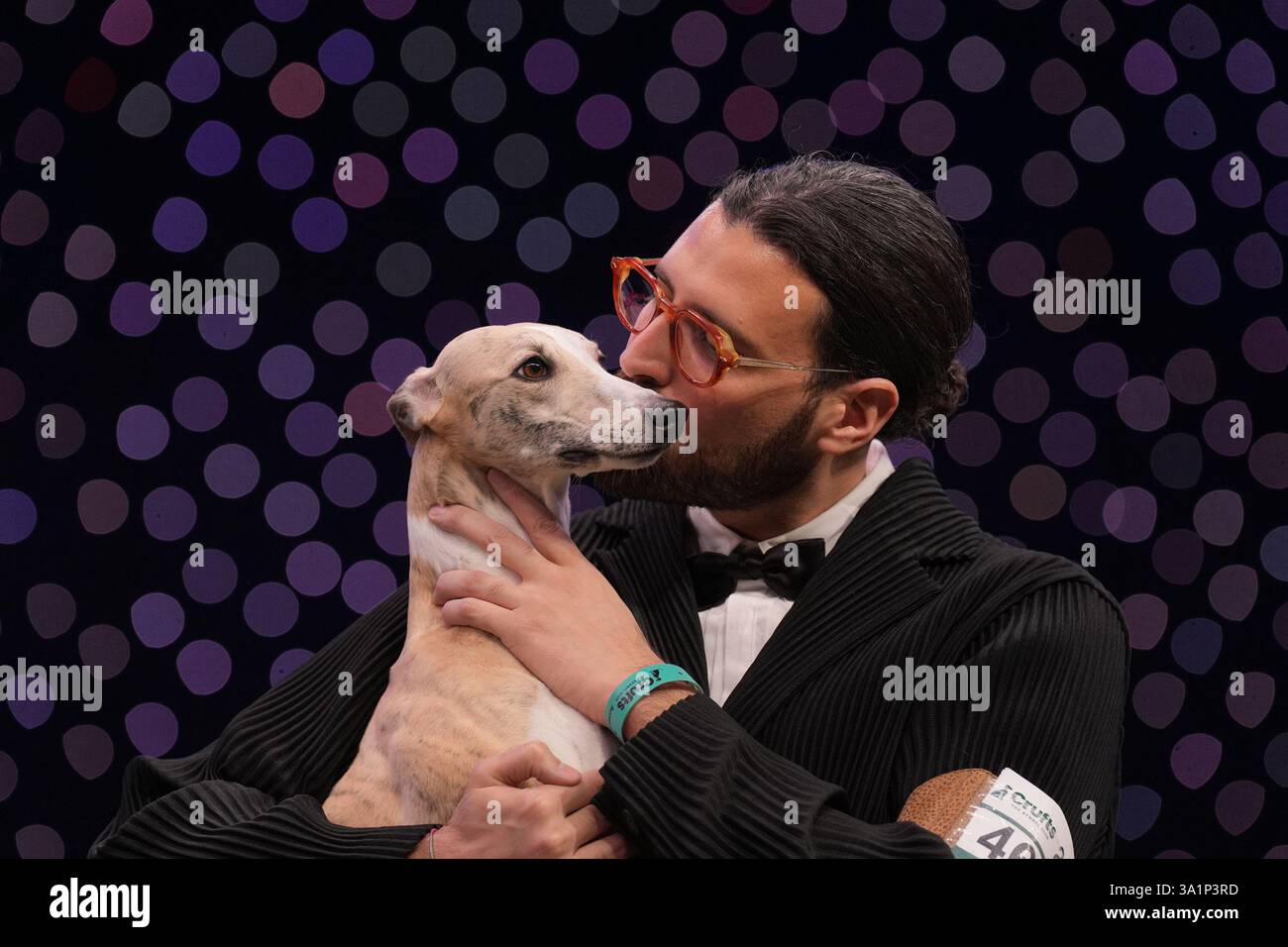 Giovanni Liguori from Italy with whippet Miuccia, winner of the Best in Show final at the Crufts ...