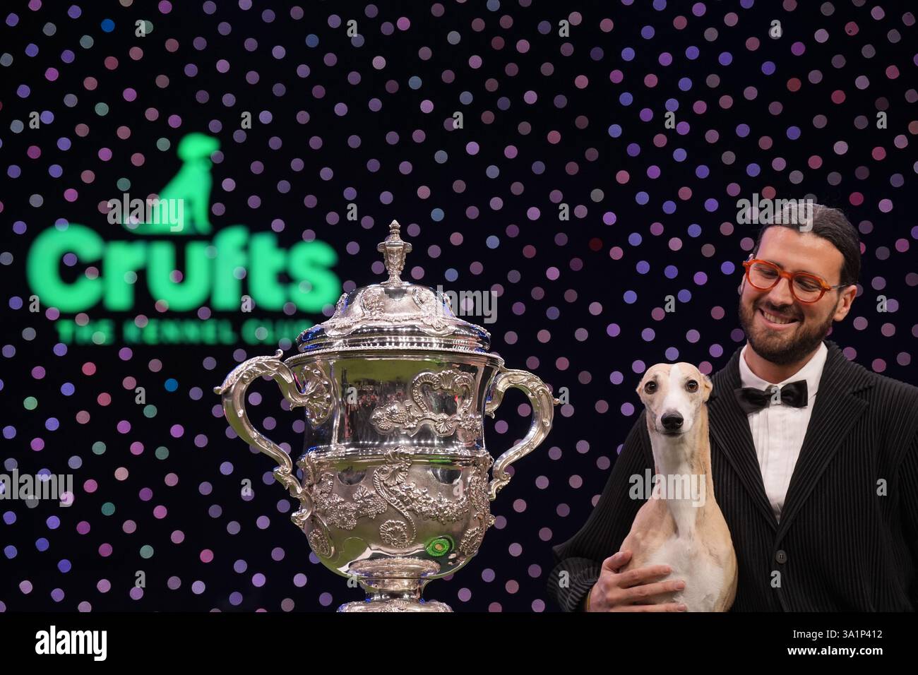 Giovanni Liguori from Italy with whippet Miuccia, winner of the Best in Show final at the Crufts ...