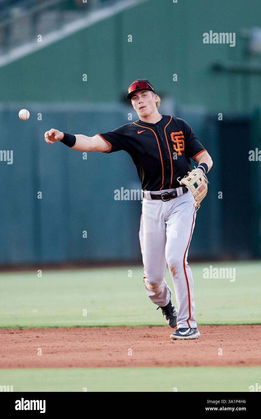 ACL Giants shortstop Walker Martin (7) throws to first base during an ...