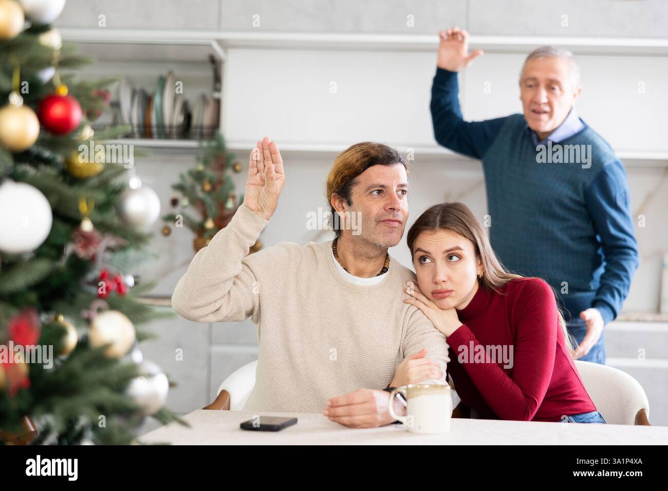 Sad couple listens to their elderly father scream and swear while ...