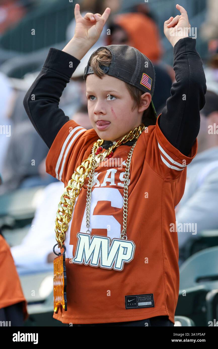 AUSTIN, TX - MARCH 09: A young fan holds Horns Up in the stands during ...