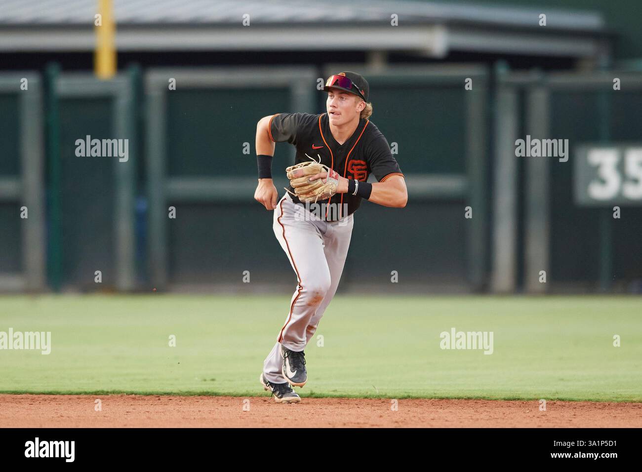 ACL Giants shortstop Walker Martin (7) tracks a ground ball during an ...