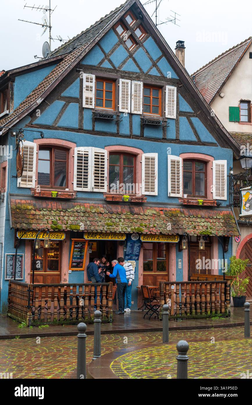 Ribeauville, Alsace, France. Small town on a rainy evening. Some friend ...