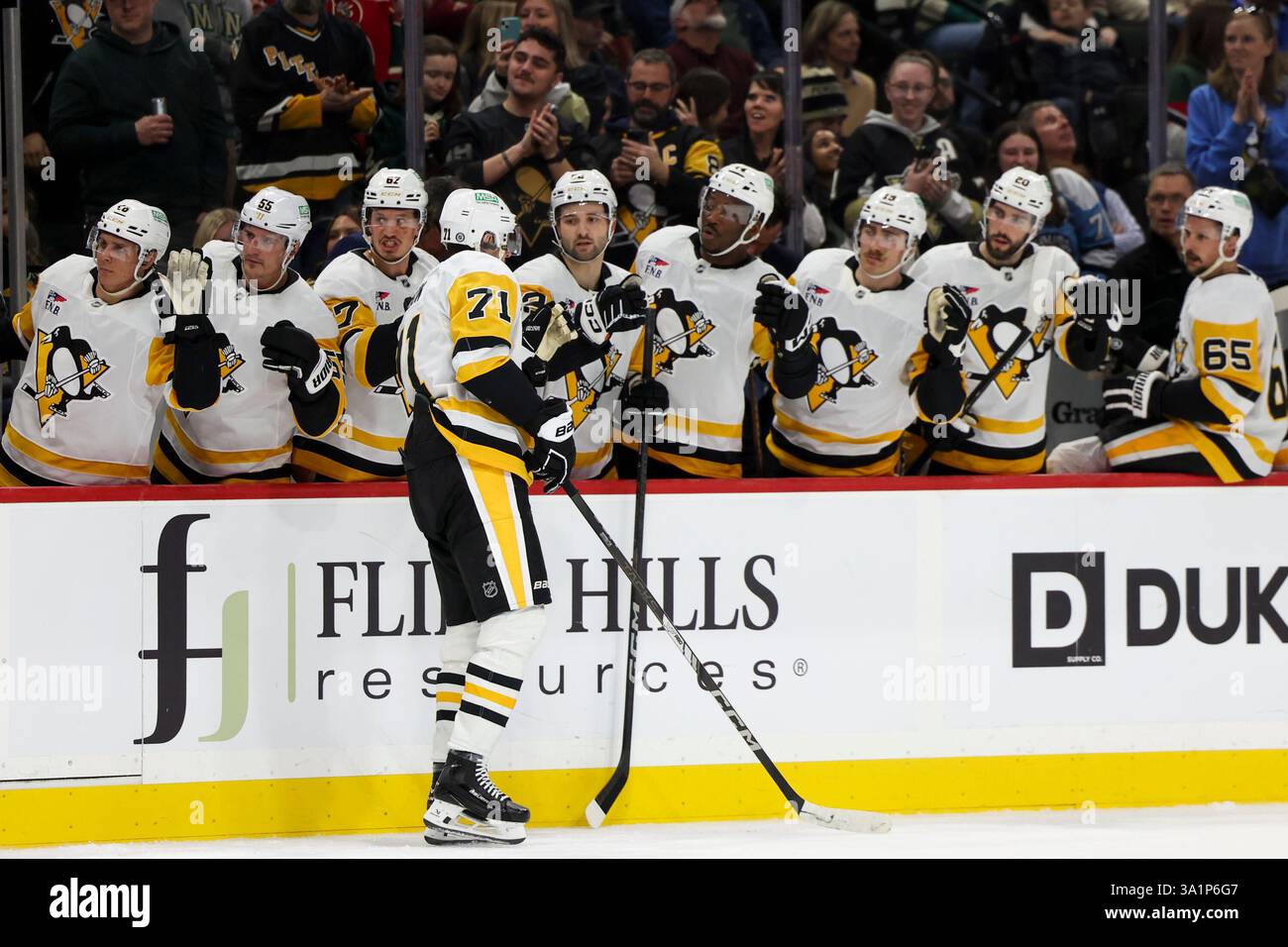 Pittsburgh Penguins center Evgeni Malkin (71) celebrates at the bench ...