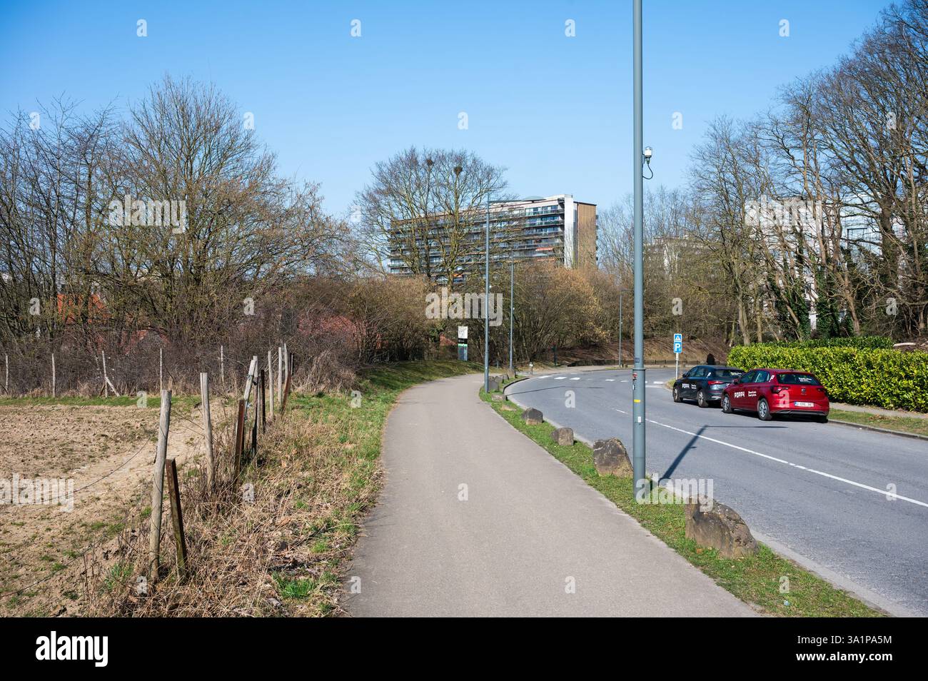 Avenue Emmanuel Mounier, with a cycling path to high rise apartment ...