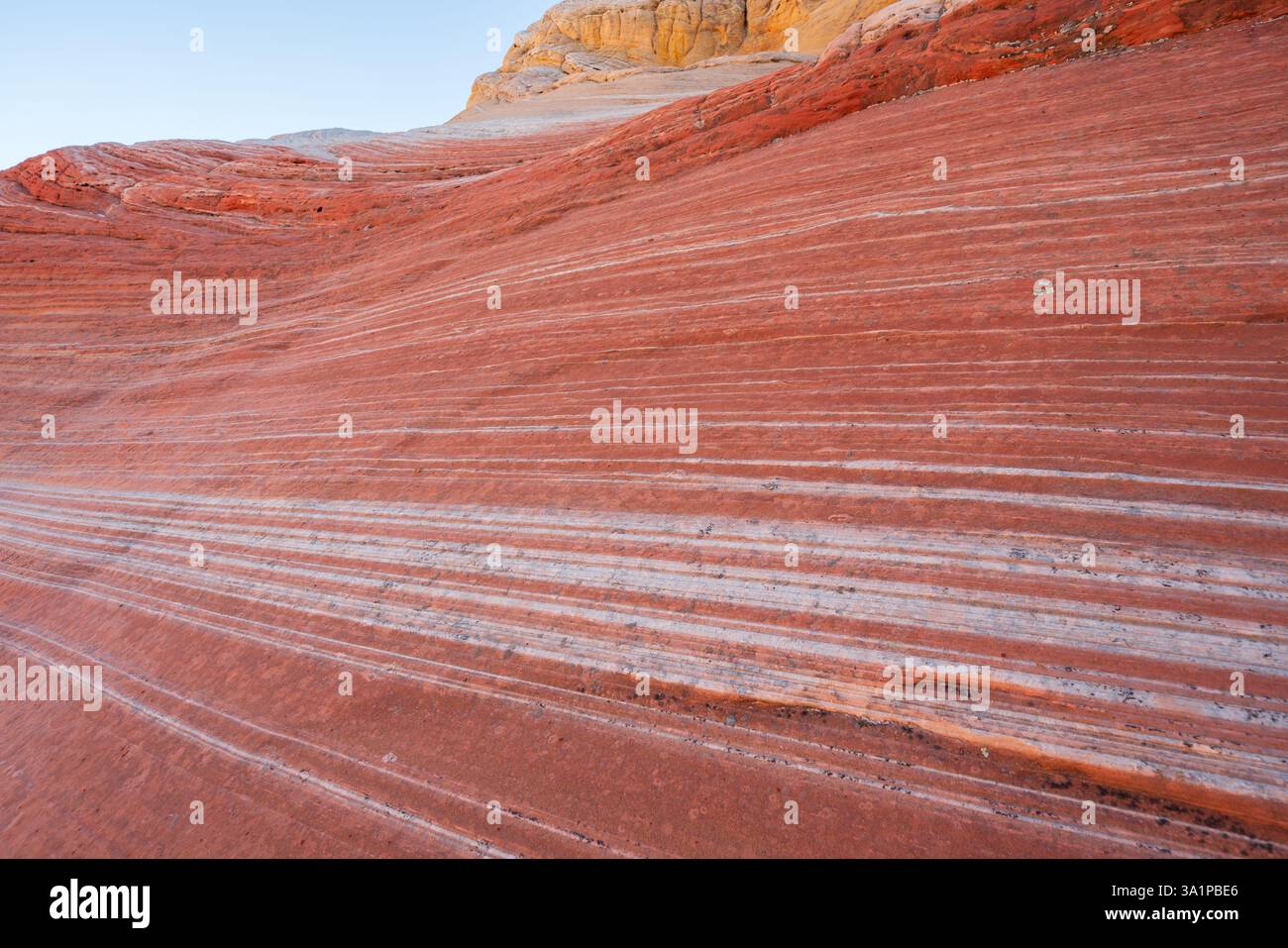 Striking red and white striped rock formations dominate the landscape ...