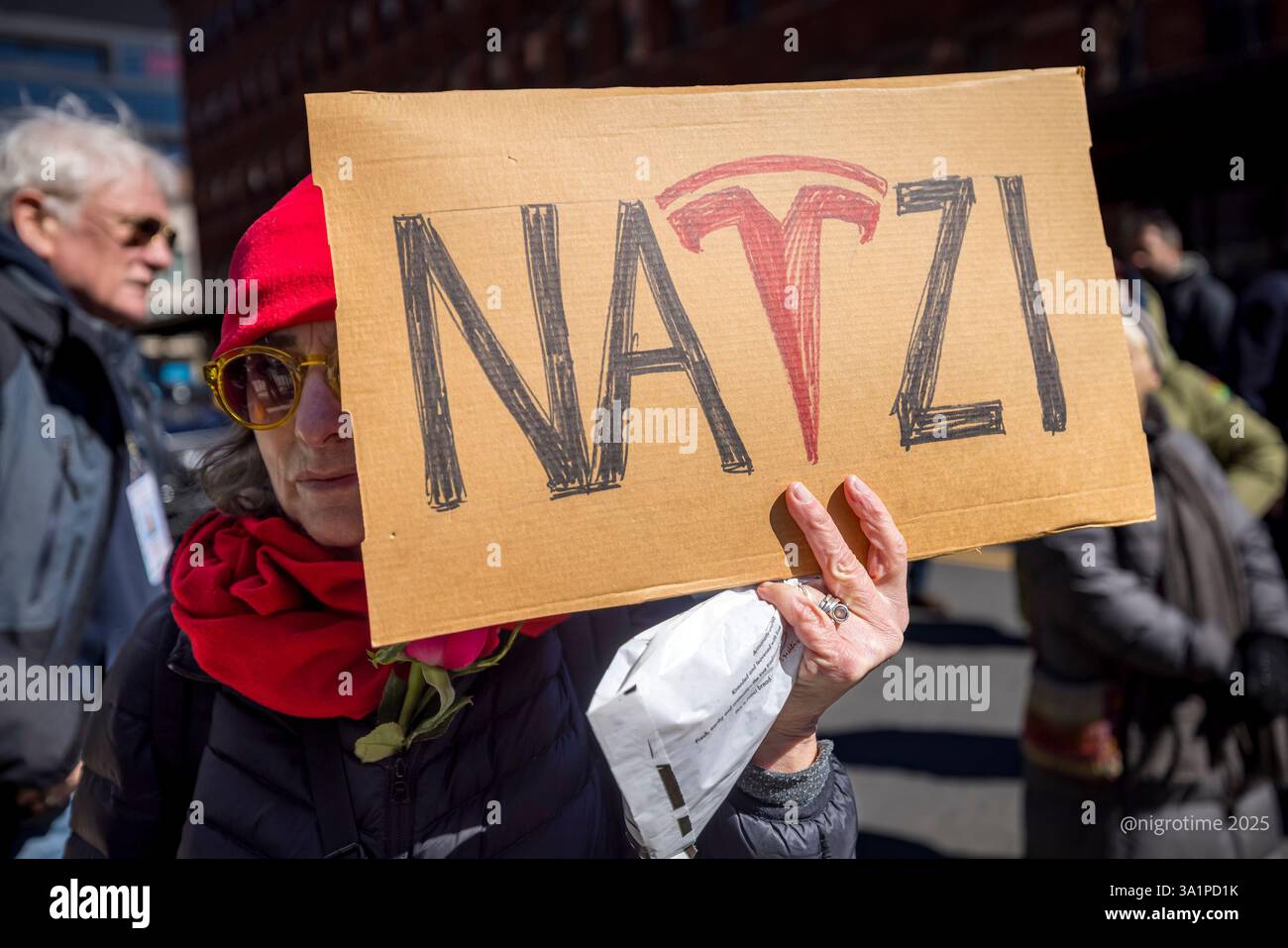 New York, United States. 08th Mar, 2025. A protestor outside a Tesla ...