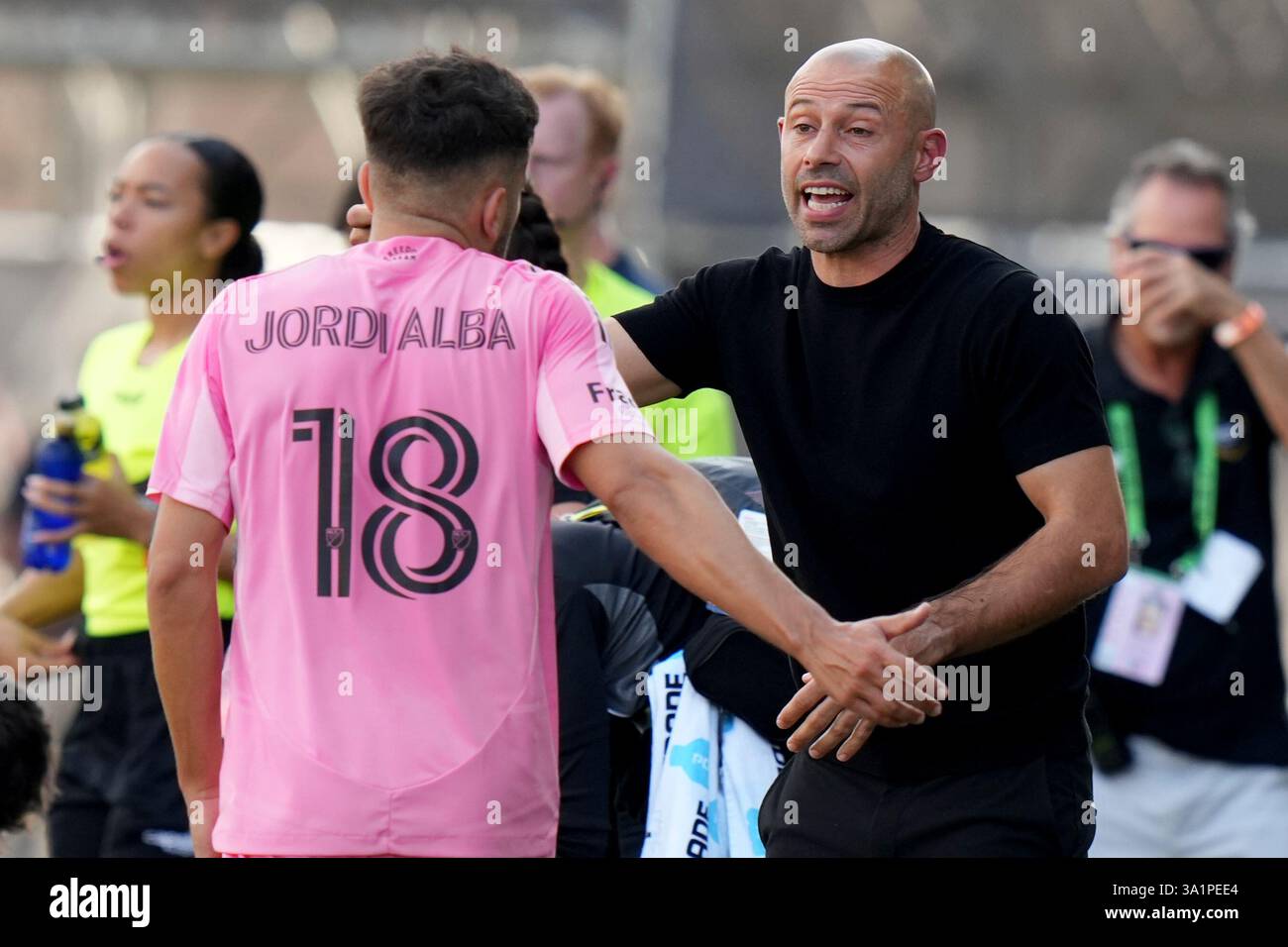 Inter Miami head coach Javier Mascherano, right, talks with defender ...