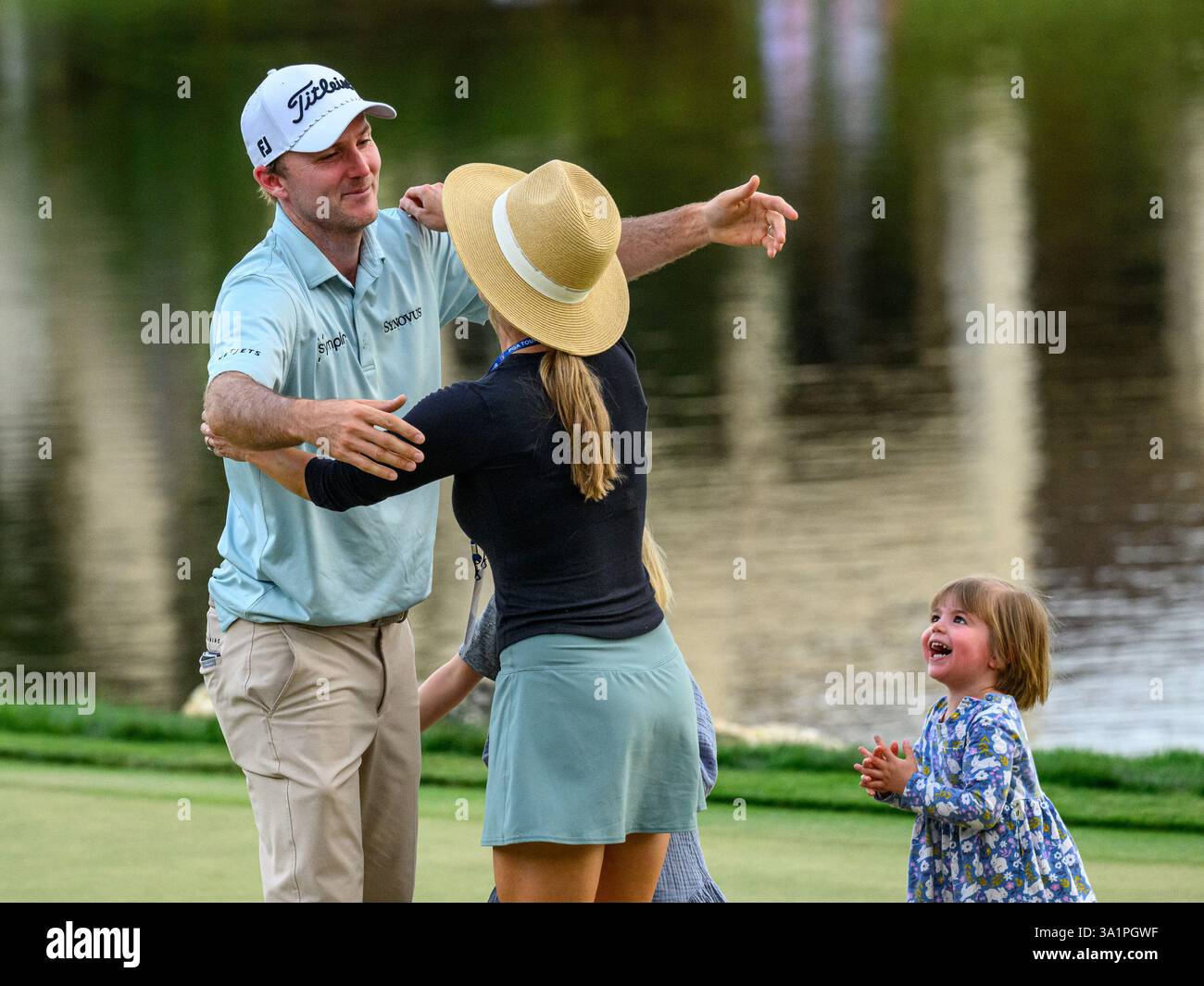 Orlando, FL, USA. 9th Mar, 2025. Russell Henley is greeted by his wife Teil and youngest ...