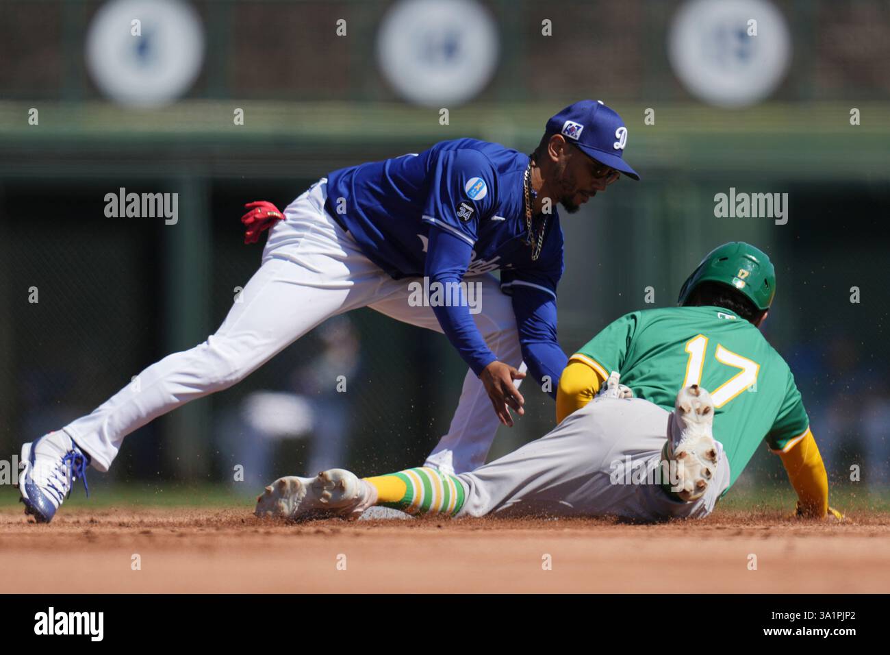Los Angeles Dodgers shortstop Mookie Betts, left, tags out Athletics ...