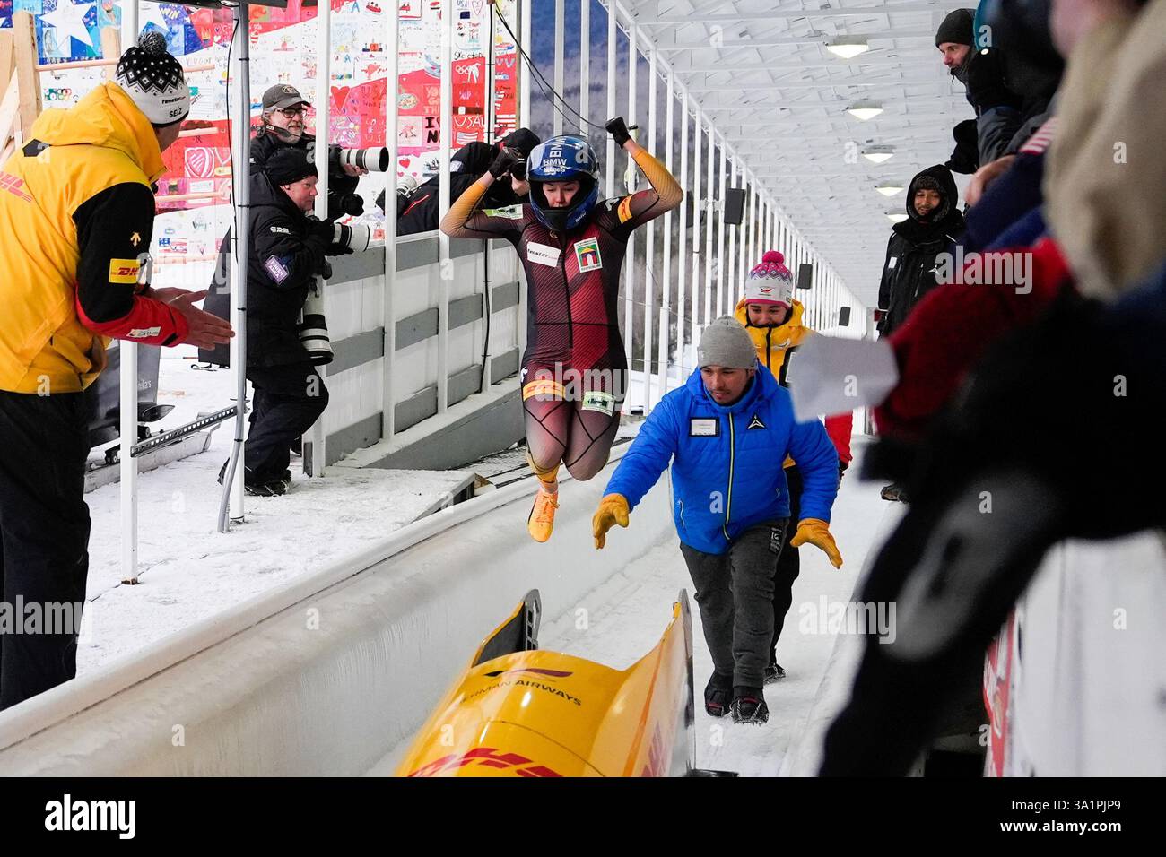 Laura Nolte, center, of Germany, reacts after the fourth run in the ...