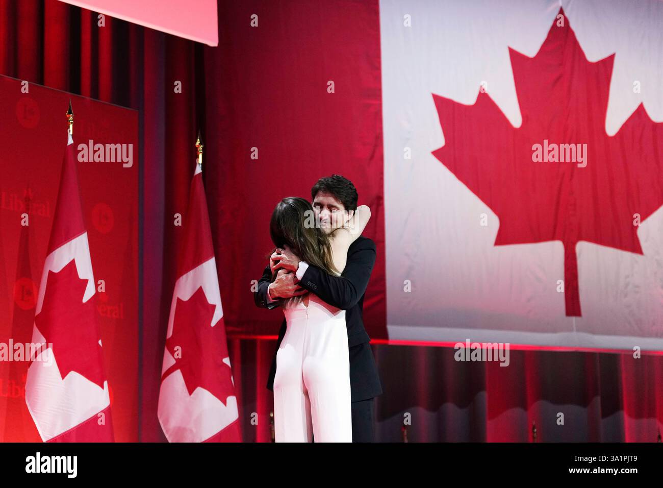 Canadian Prime Minister Justin Trudeau, right, embraces his daughter ...