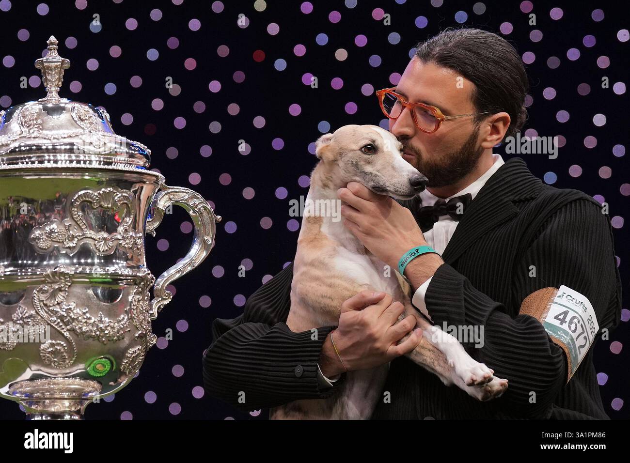 Giovanni Liguori from Italy with whippet Miuccia, winner of the Best in Show final at the Crufts ...