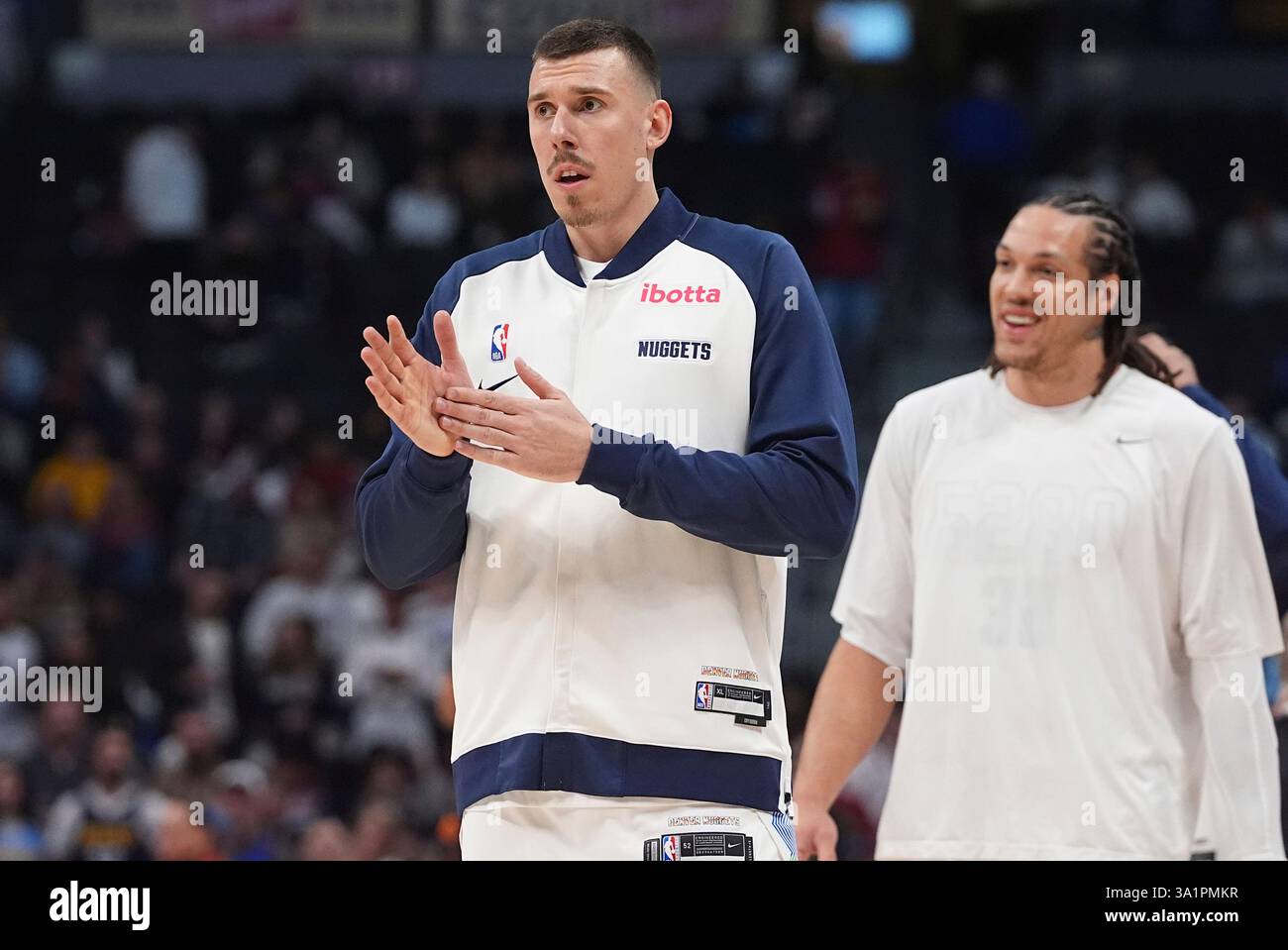Denver Nuggets forwards Vlatko Cancar (31) and Aaron Gordon (32) in the ...