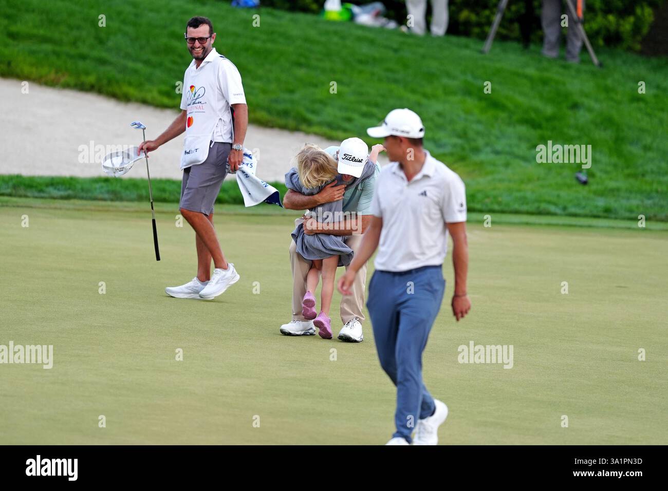 ORLANDO, FL - MARCH 09: PGA golfer Russell Henley is greeted by his ...