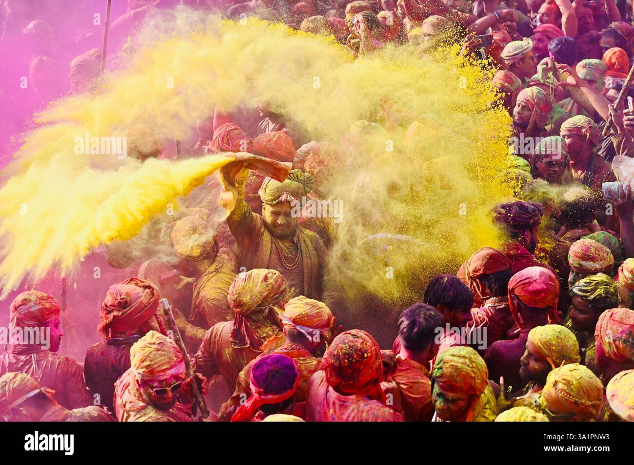MATHURA, INDIA - MARCH 9: People smear each other with coloured powder ...