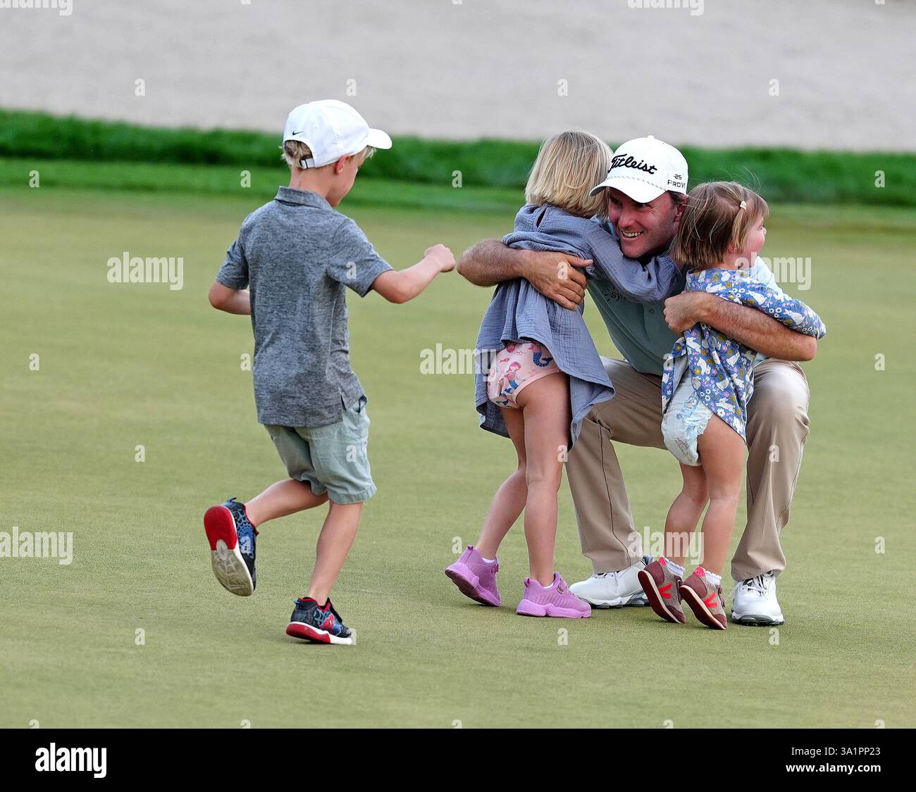 ORLANDO, FL - MARCH 09: PGA golfer Russell Henley hugs daughter Ruth in ...