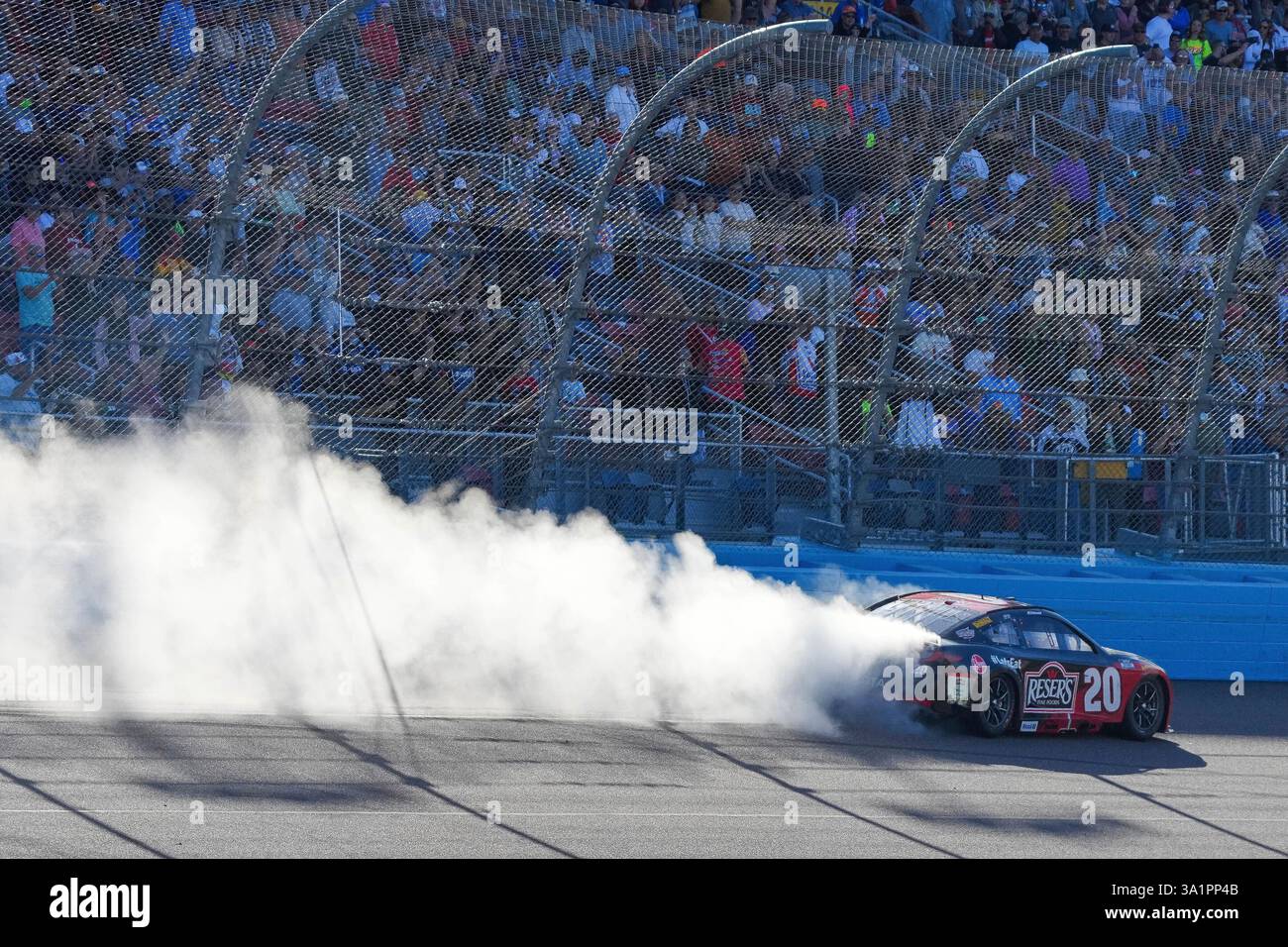 Christopher Bell (20) leaves a trail of smoke as he celebrates his win ...