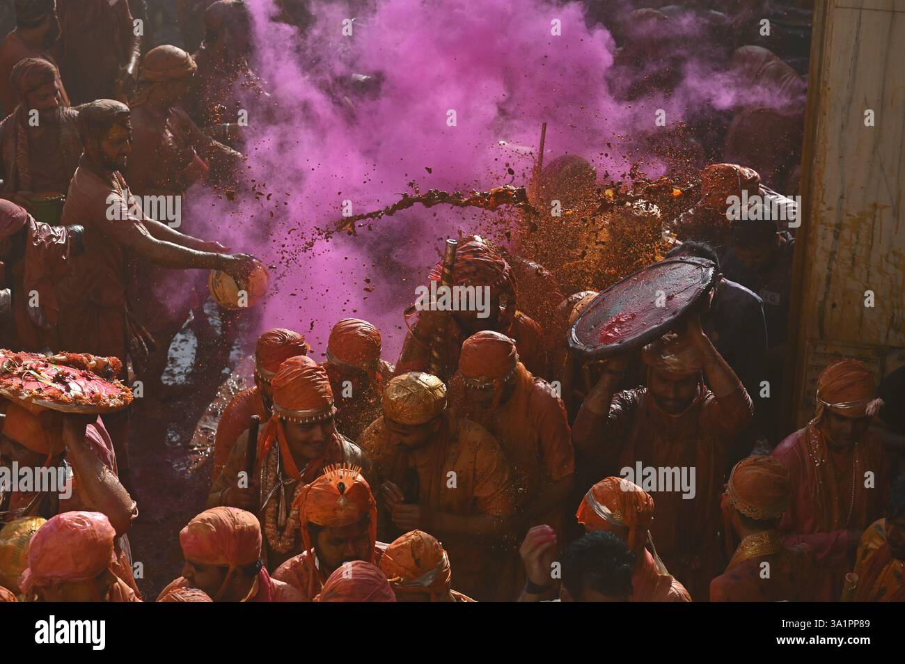 MATHURA, INDIA - MARCH 9: People smear each other with coloured powder ...