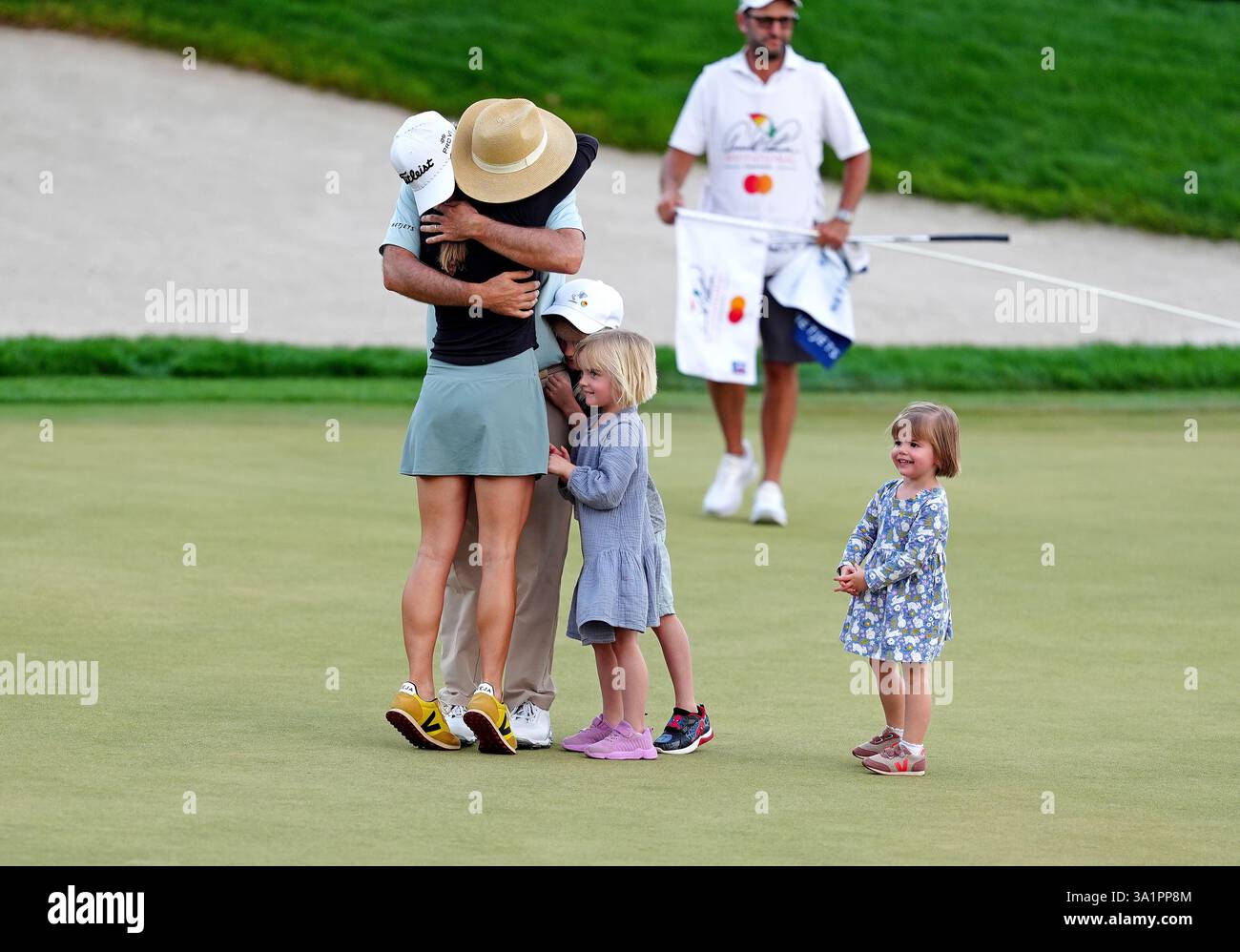ORLANDO, FL - MARCH 09: PGA golfer Russell Henley hugs his wife Teil ...