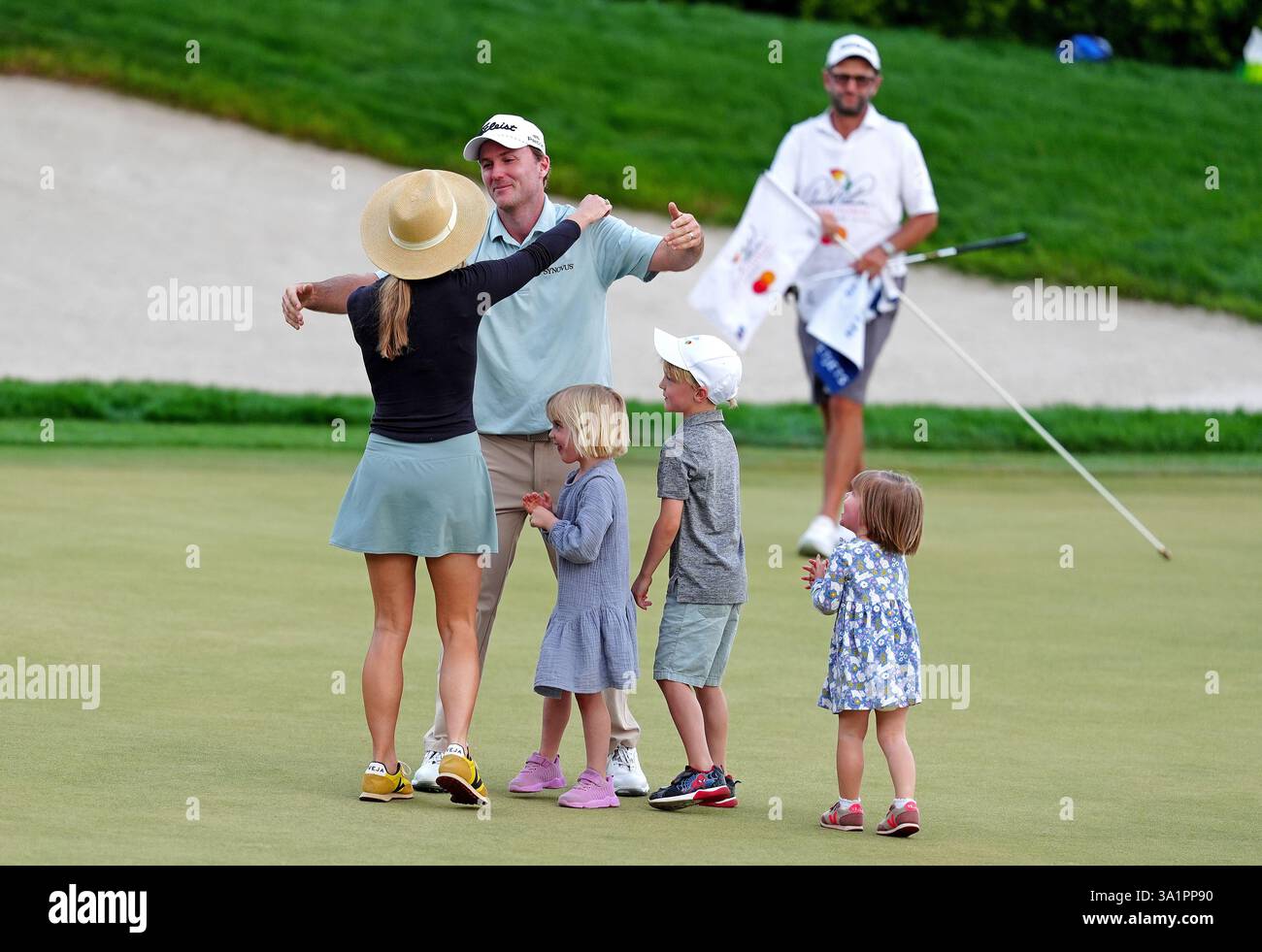 ORLANDO, FL - MARCH 09: PGA golfer Russell Henley hugs his wife Teil ...