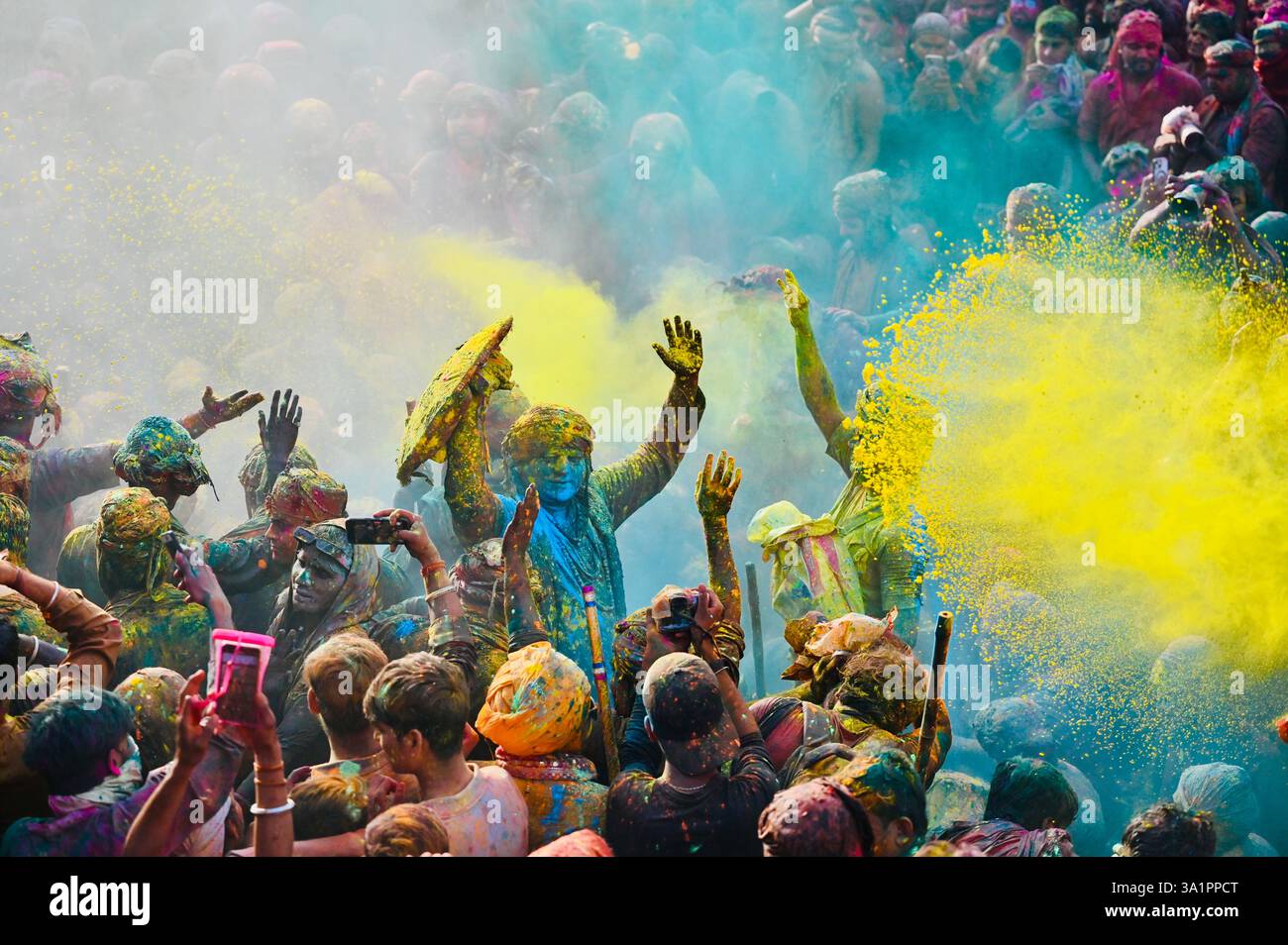 MATHURA, INDIA - MARCH 9: People smear each other with coloured powder ...