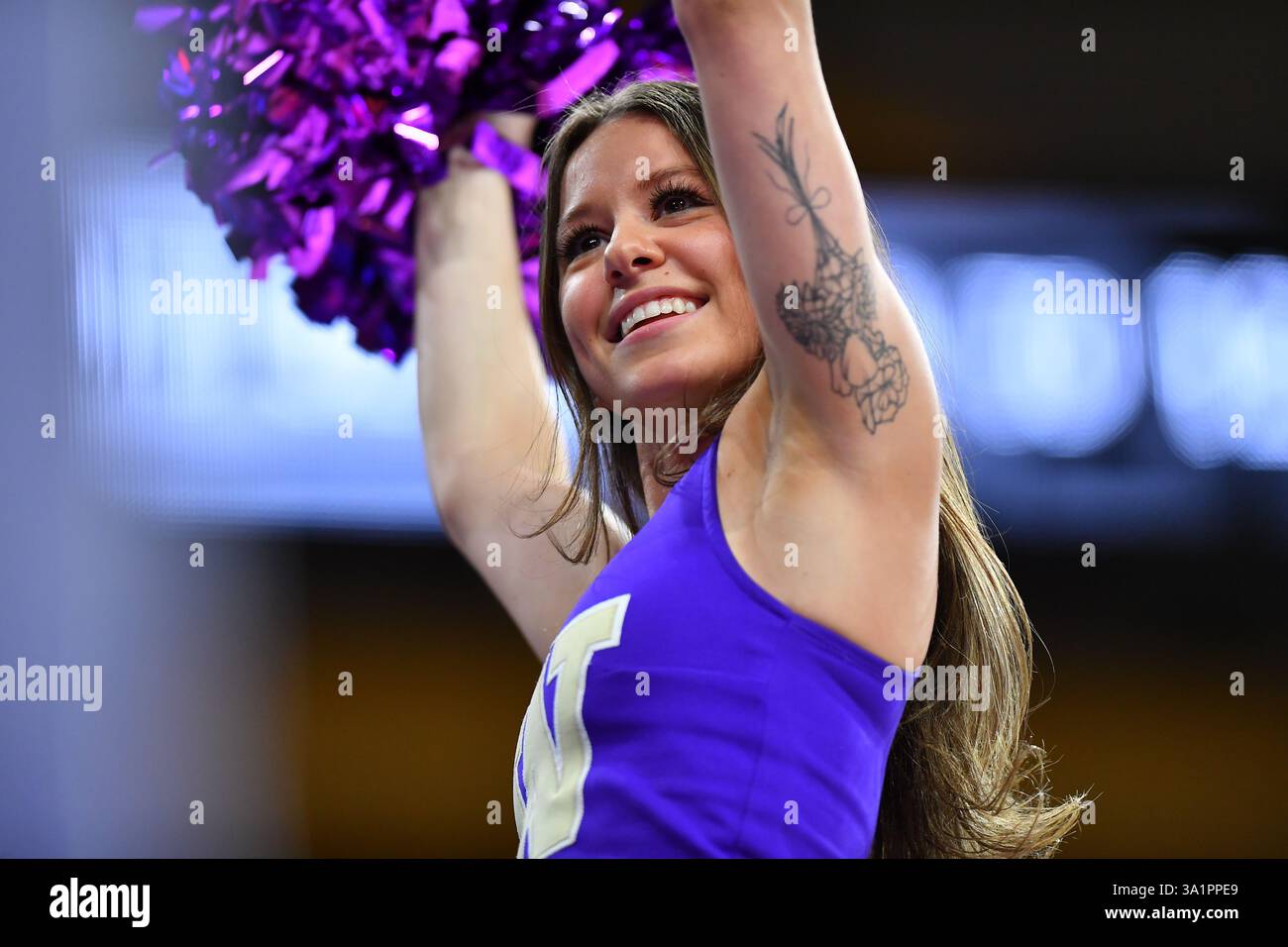 March 09, 2025: A Washington cheerleader stands on another's shoulders ...