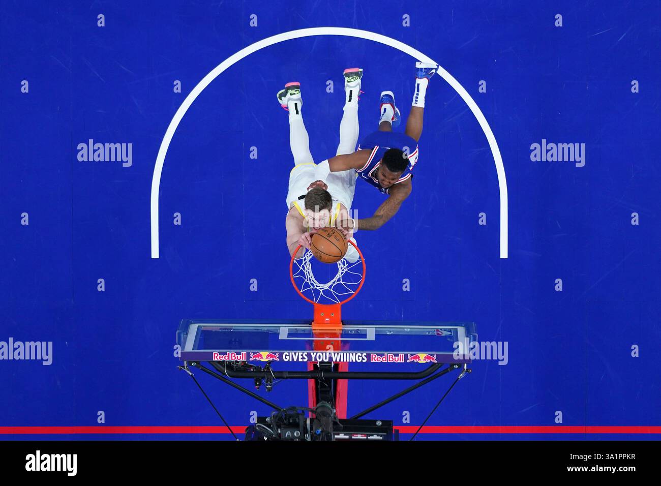 Utah Jazz's Kyle Filipowski, left, dunks against Philadelphia 76ers ...