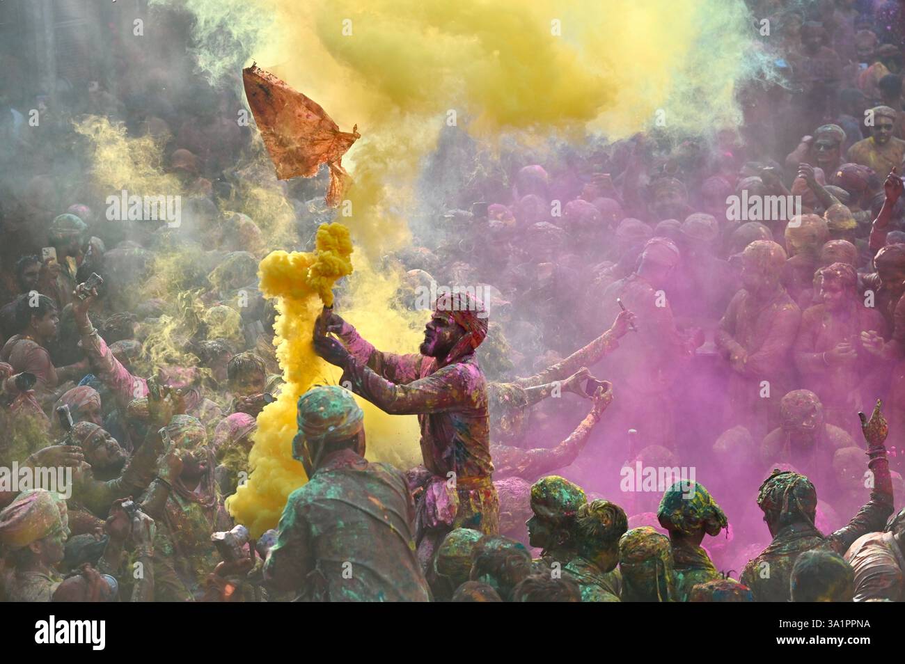 MATHURA, INDIA - MARCH 9: People smear each other with coloured powder ...