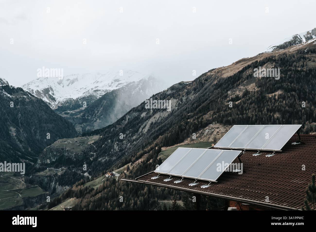 Solar Panels on Rooftop with Mountain Backdrop. solar power technology ...