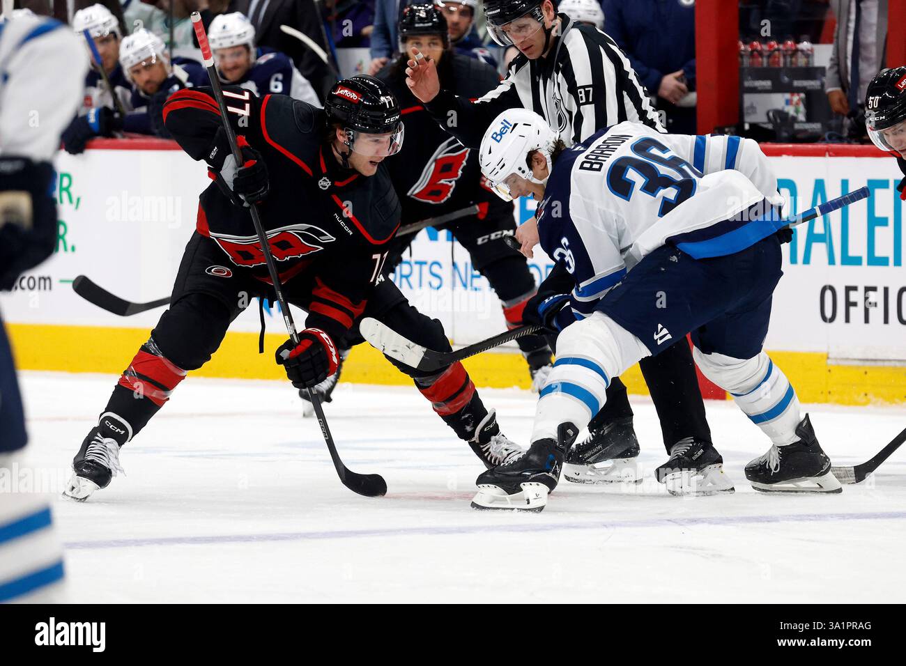 Carolina Hurricanes' Mark Jankowski (77) faces off against Winnipeg ...