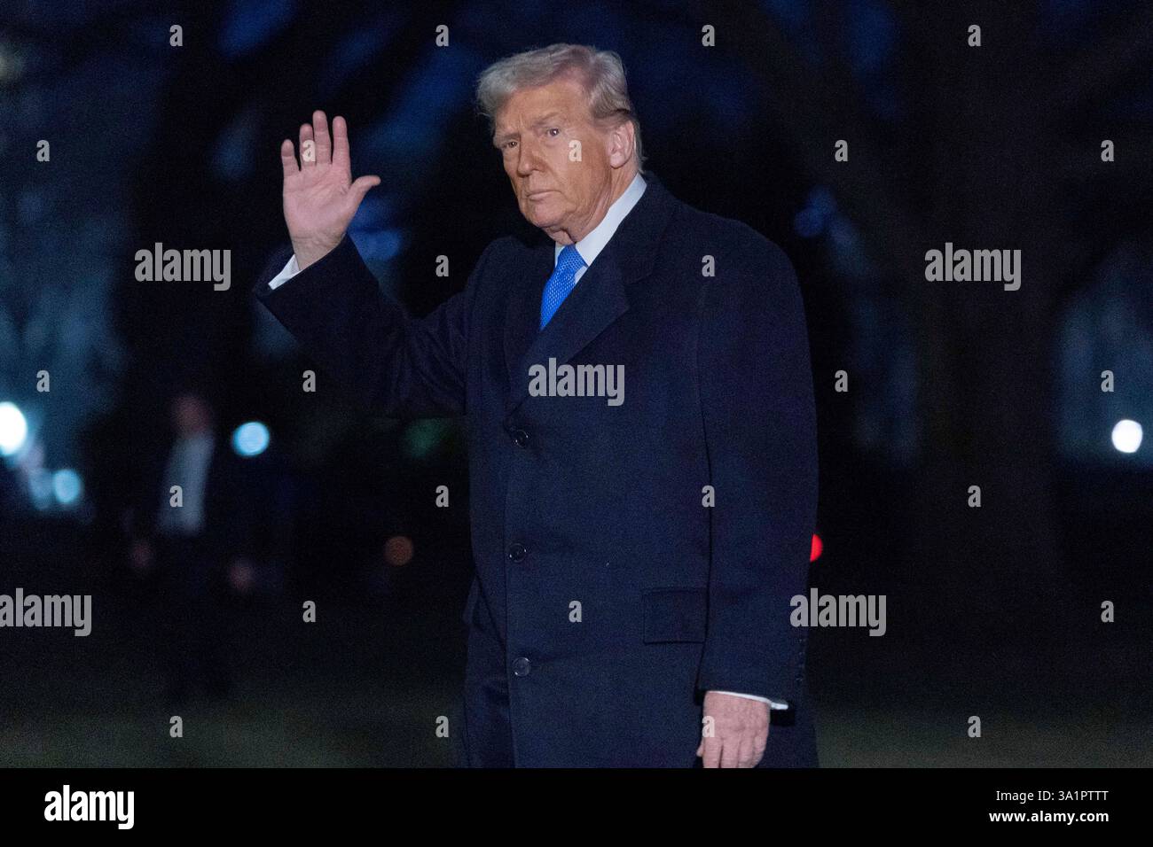 President Donald Trump waves to the media as he walks on South Lawn of ...