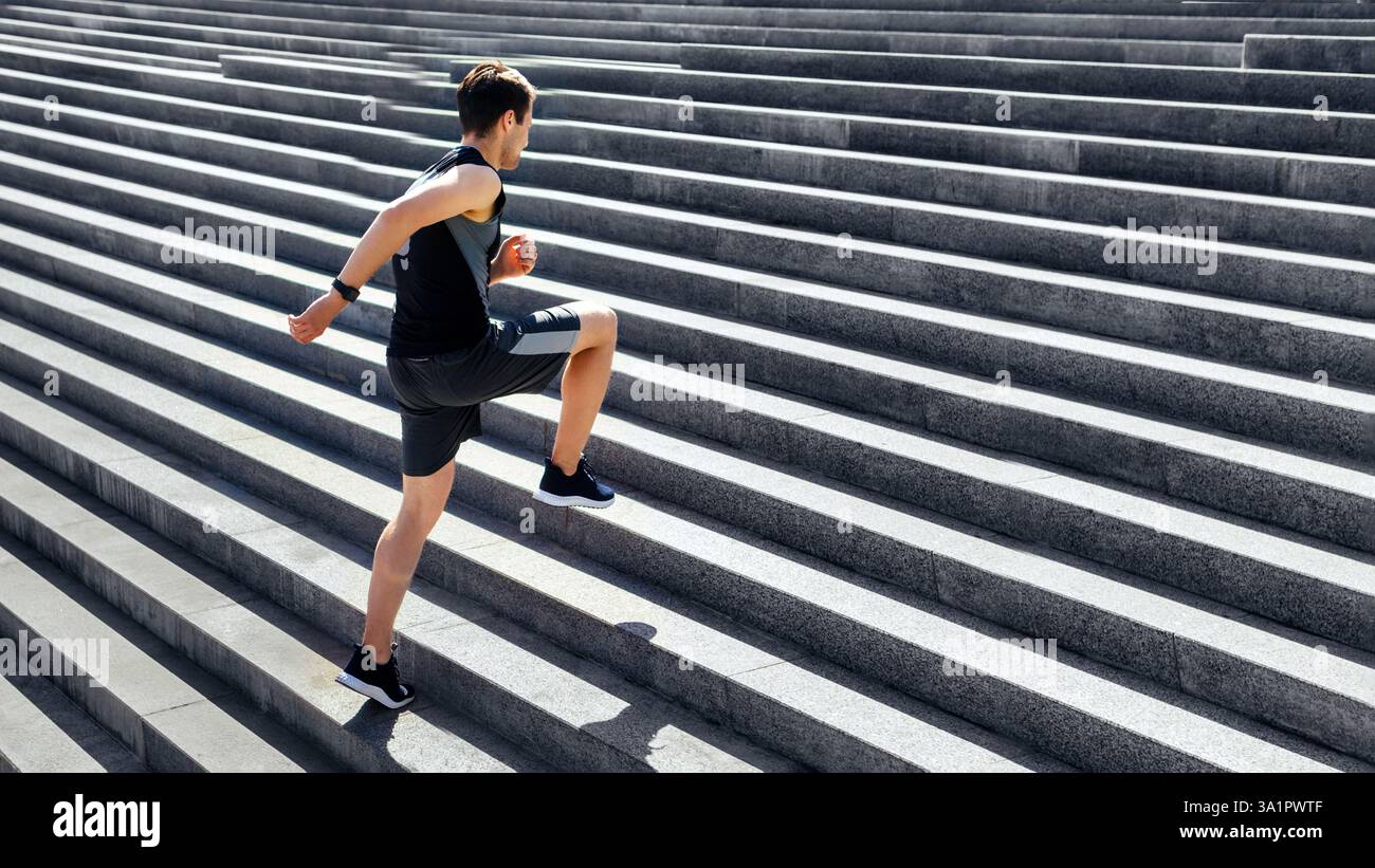 Cardio workout. Guy doing exercises and runs up the stairs, raising his ...