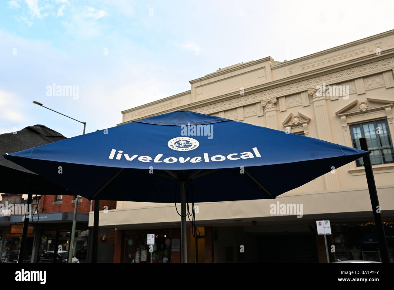 City of Port Phillip live love local slogan on a blue umbrella, which ...