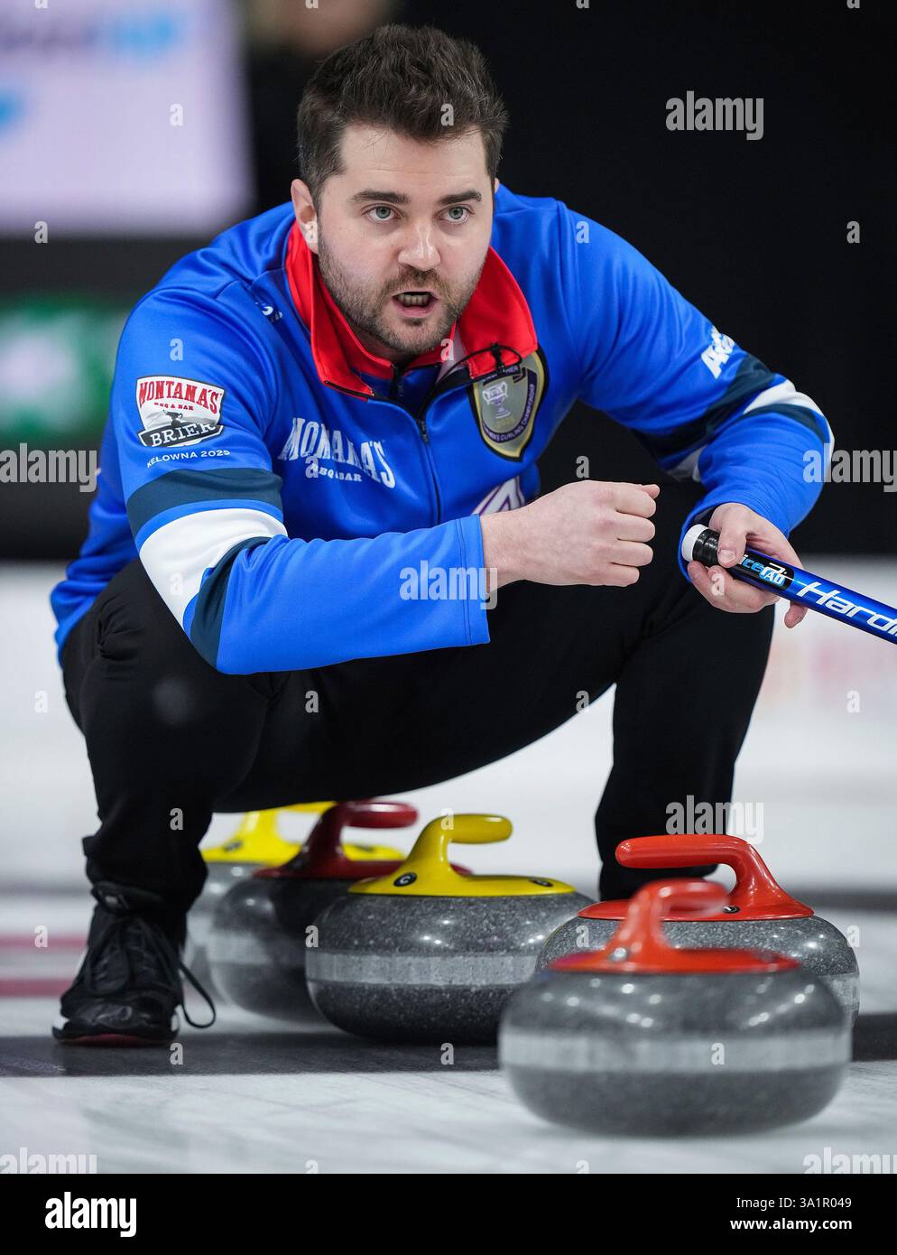 Manitoba-Dunstone skip Matt Dunstone calls to the sweepers while ...
