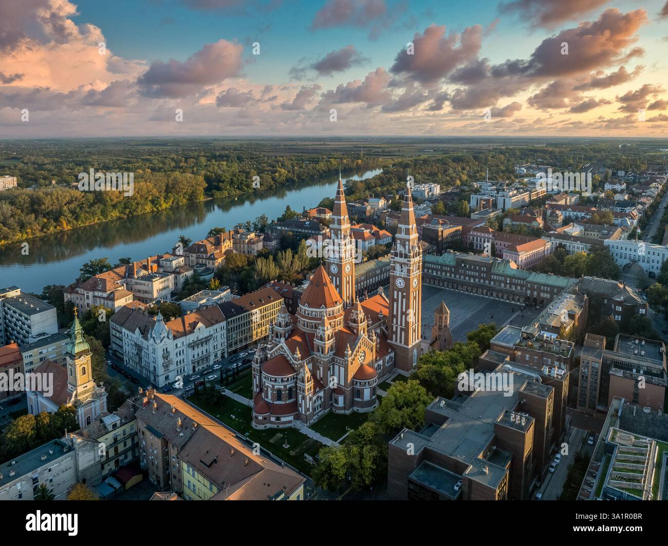 Aerial view of Szeged with Tisza river Votive Church, historic center ...
