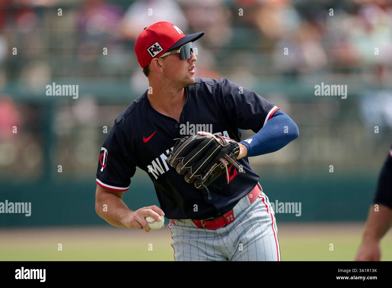 Minnesota Twins shortstop Brooks Lee (2) trowing during warmups before ...