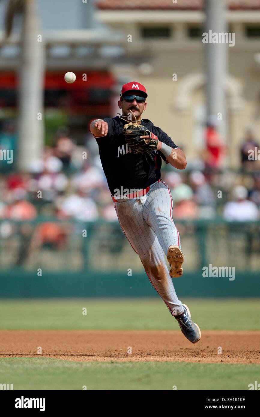 Minnesota Twins second baseman Mickey Gasper (11) throws to first base ...