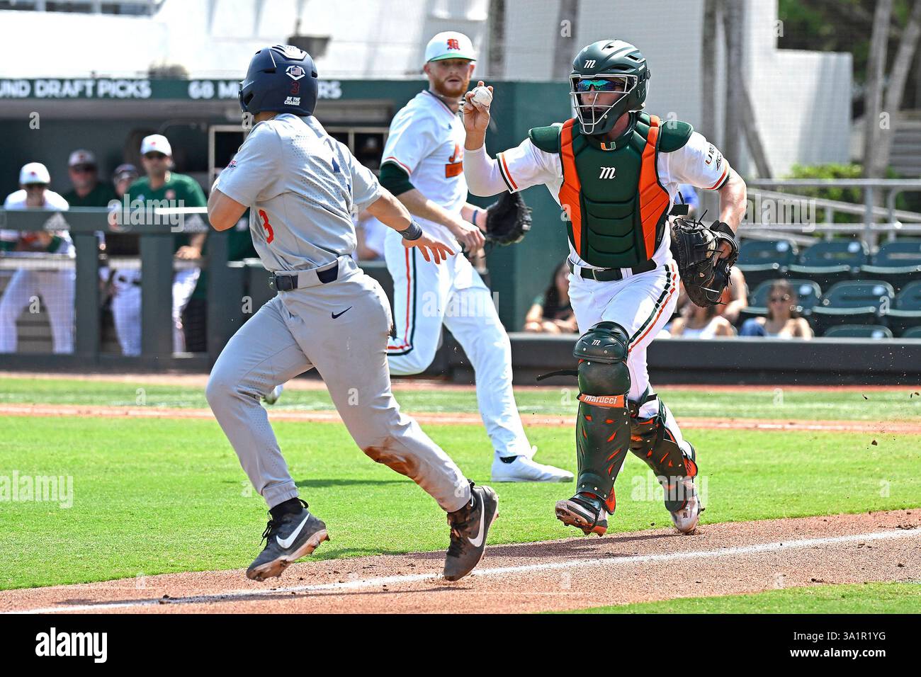 CORAL GABLES, FL - MARCH 09: Miami catcher Tanner Smith (30) runs down ...