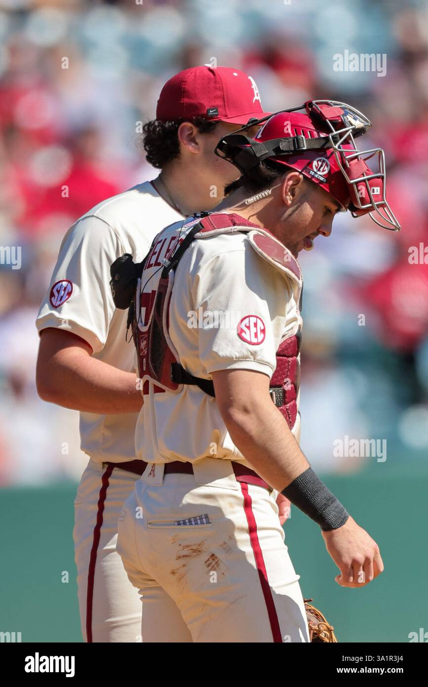 March 9, 2025: Arkansas catcher Ryder Helfrick (27) has a quick ...