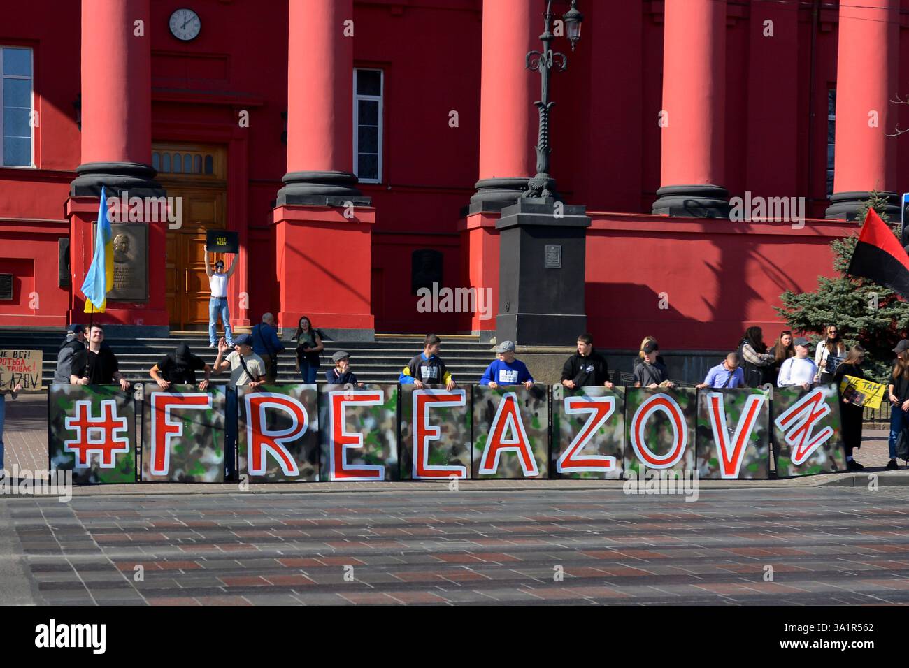 Activists, servicemen and relatives of Ukrainian POWs hold placards ...
