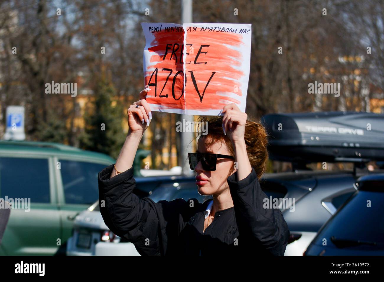 A protester holds a placard during the rally to urge for the return of ...