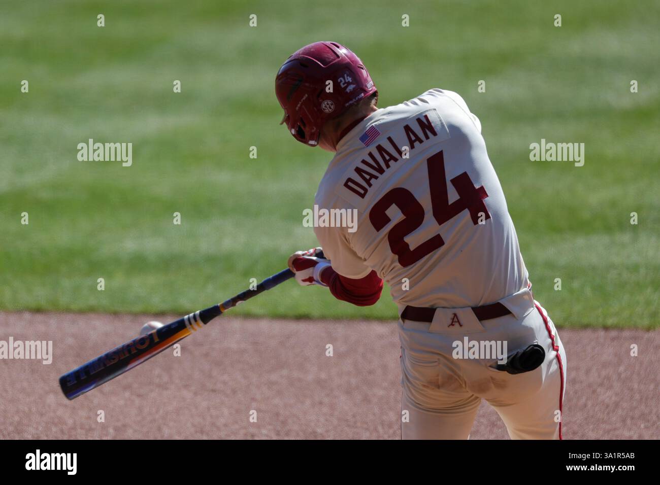 March 9, 2025: Charles Davalan (24) of Arkansas put his bat on the ball ...