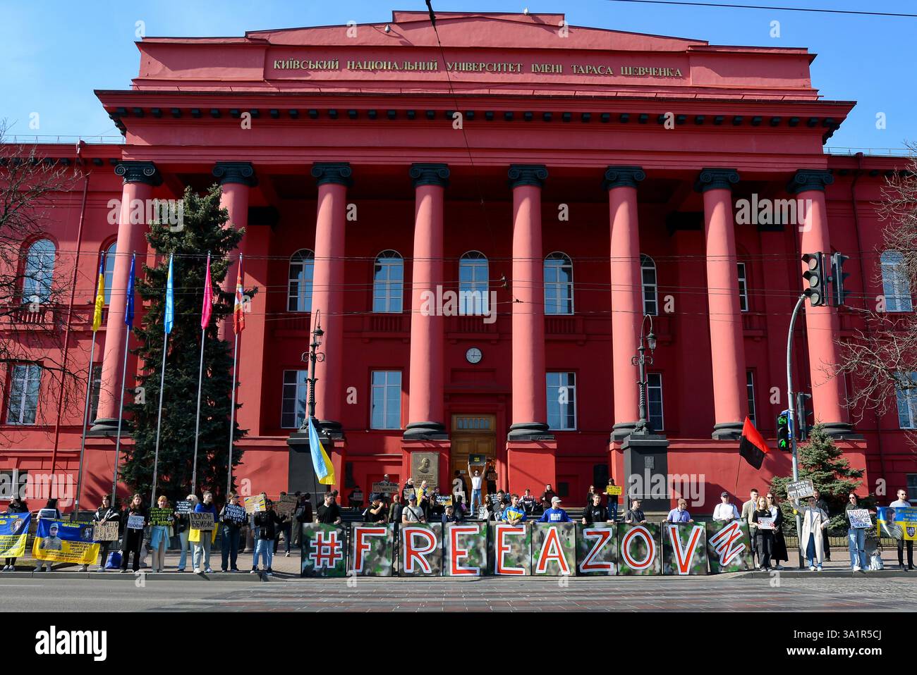 Activists, servicemen and relatives of Ukrainian POWs hold placards ...