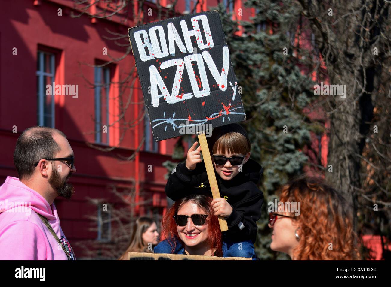 A boy holds a placard during the rally to urge for the return of ...