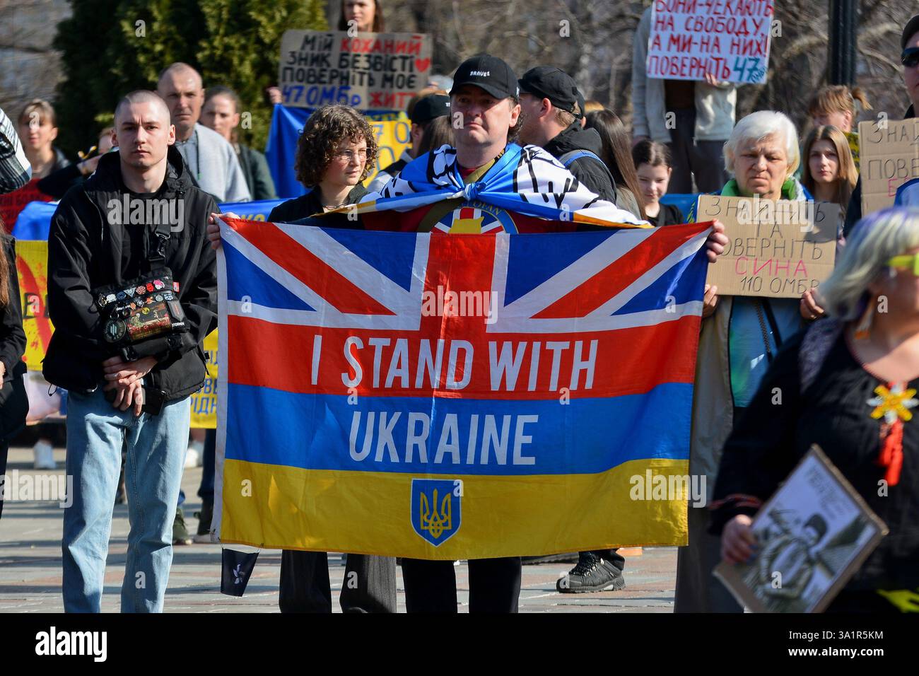 An activist holds a banner that says "I stand with Ukraine" during the ...
