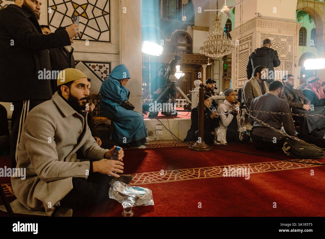 Damascus, Syria. 3rd Mar, 2025. A man breaks his fast at the Umayyad ...