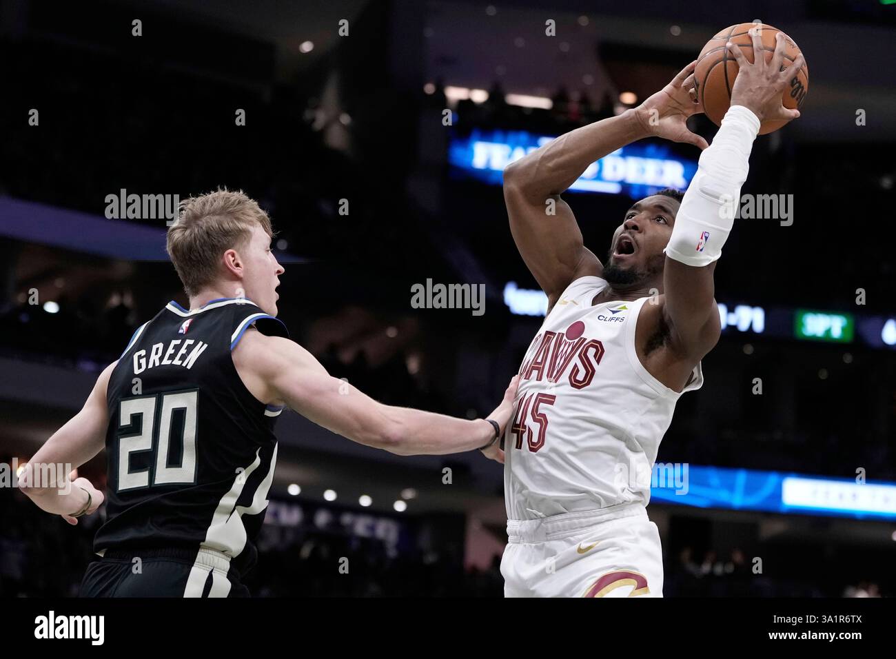 Cleveland Cavaliers' Donovan Mitchell looks to shoot past Milwaukee ...