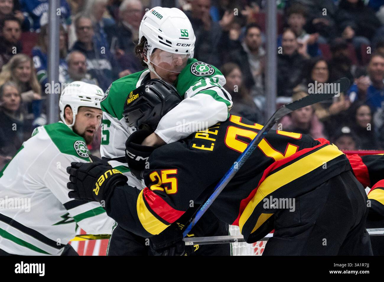 Dallas Stars' Thomas Harley (55) holds Vancouver Canucks' Elias ...