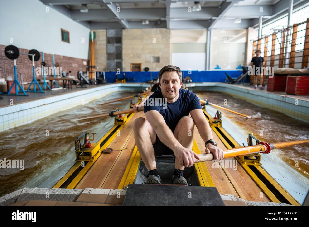 Strong rower leads crew on kayak simulator, coordination and teamwork ...